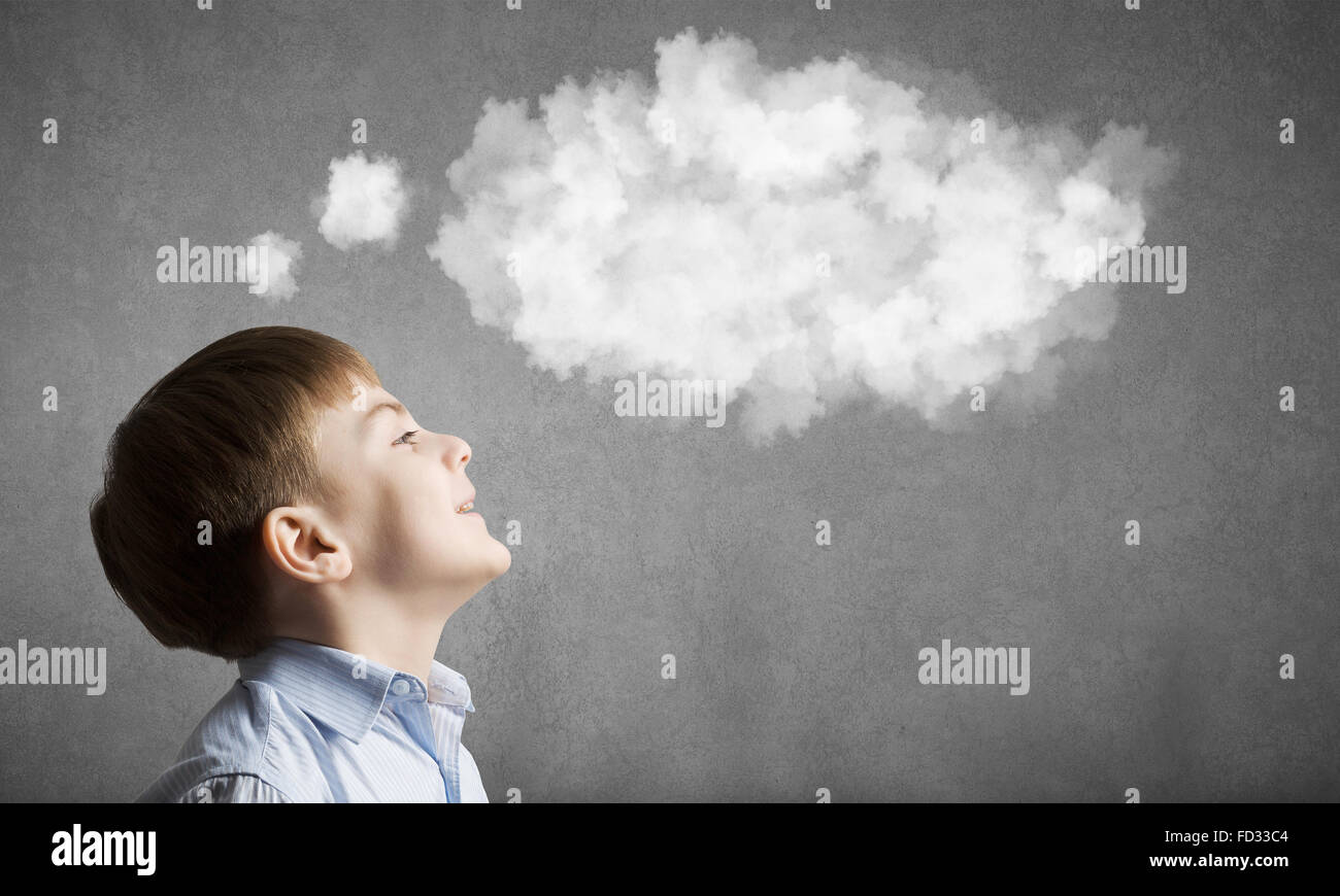 Young boy of school thinking about something Stock Photo - Alamy