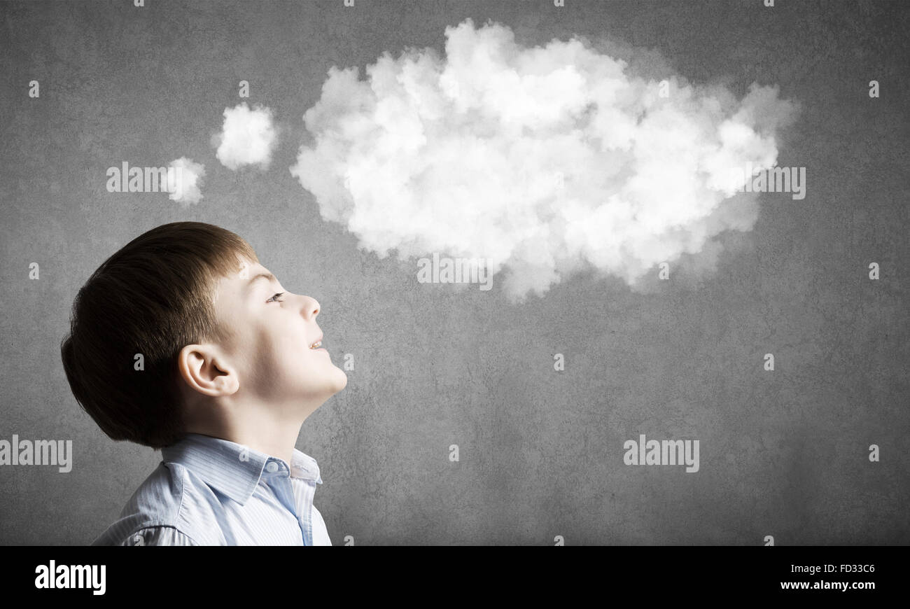 Young boy of school thinking about something Stock Photo - Alamy