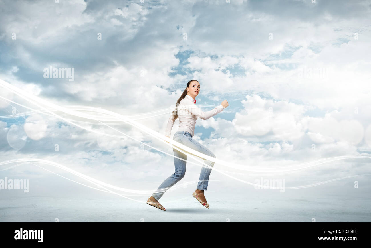 Young woman in casual running in a hurry Stock Photo - Alamy