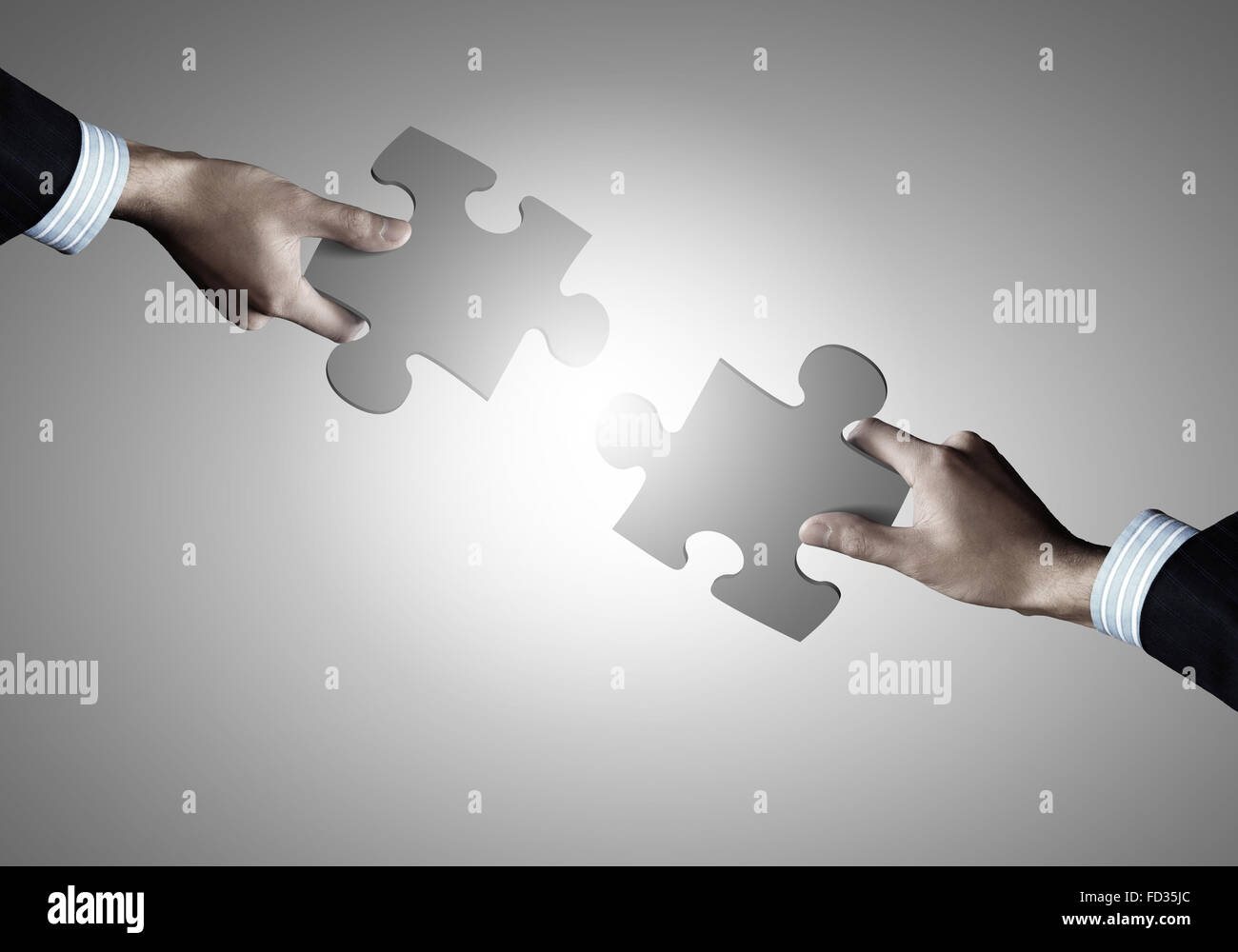 Close up of human hands connecting puzzle elements Stock Photo - Alamy