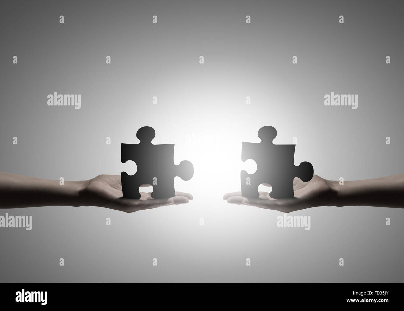 Close up of human hands connecting puzzle elements Stock Photo - Alamy
