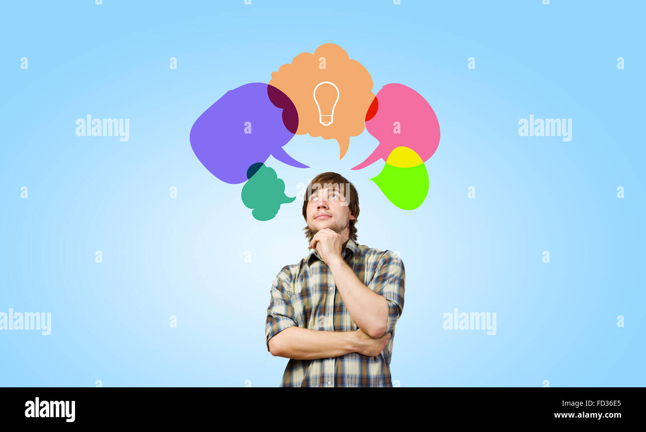 Young man and colorful thoughts above her head Stock Photo - Alamy