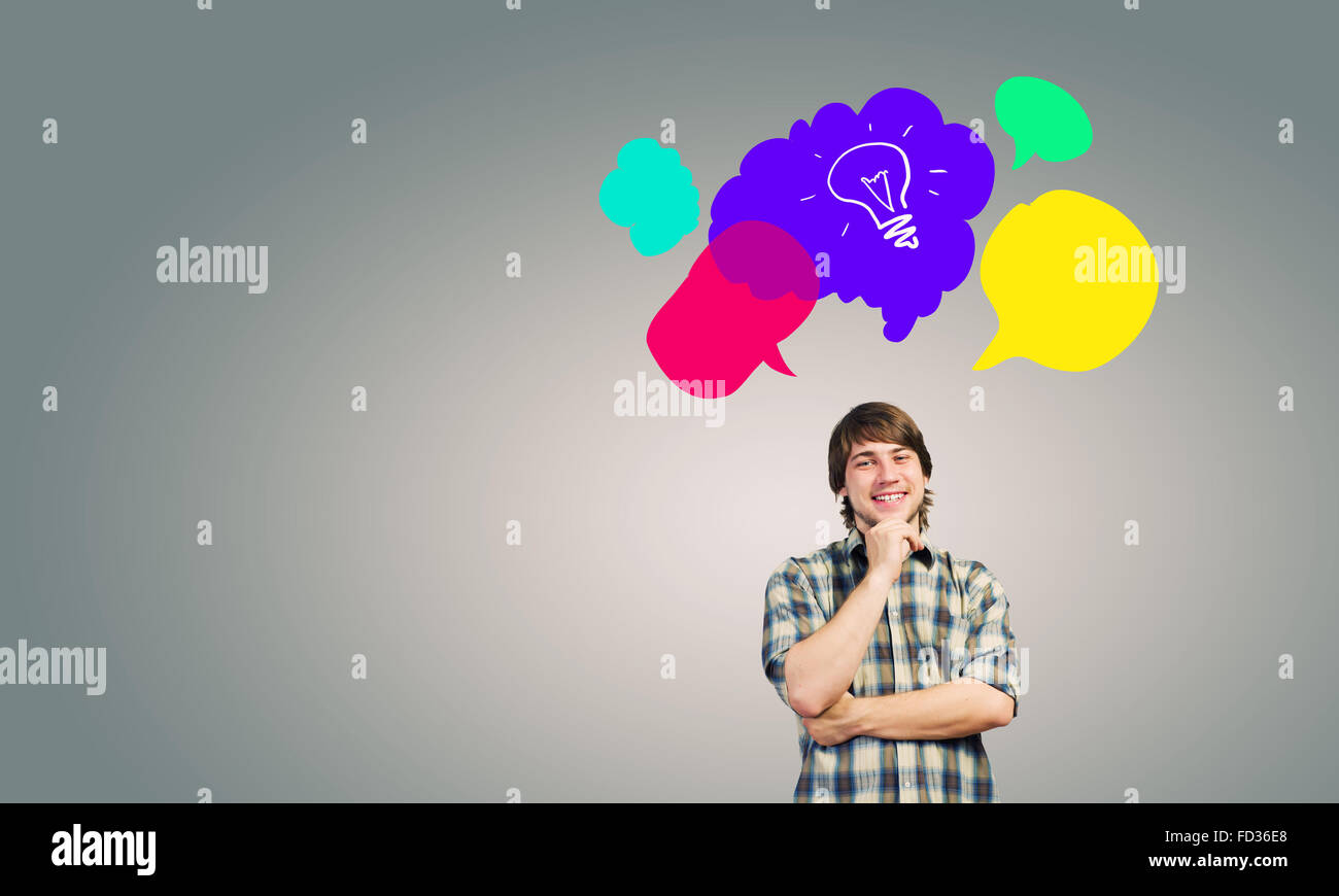 Young man and colorful thoughts above her head Stock Photo - Alamy