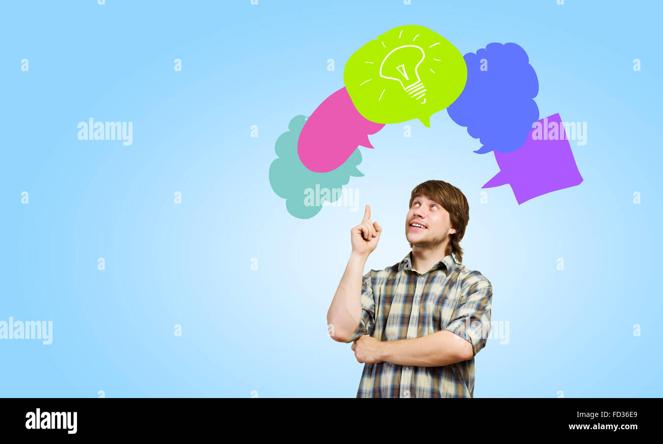 Young man and colorful thoughts above her head Stock Photo - Alamy