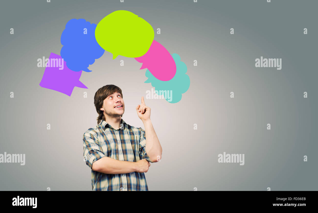Young man and colorful thoughts above her head Stock Photo - Alamy
