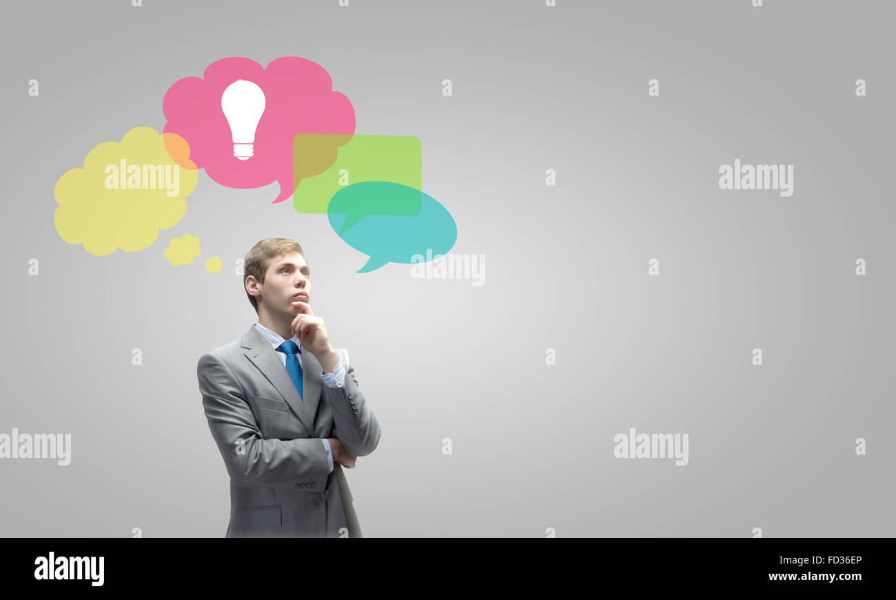 Young businessman and colorful thoughts above her head Stock Photo - Alamy