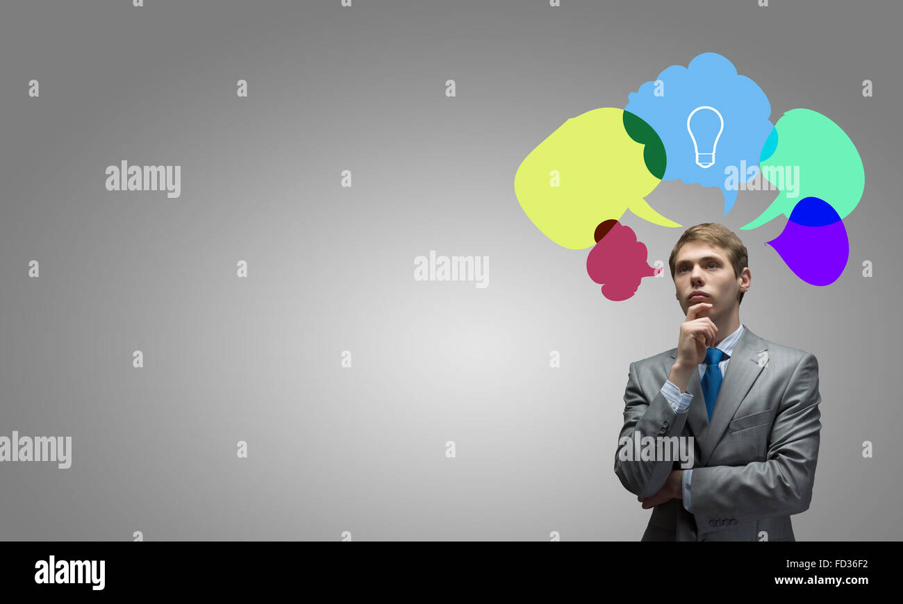 Young businessman and colorful thoughts above her head Stock Photo - Alamy