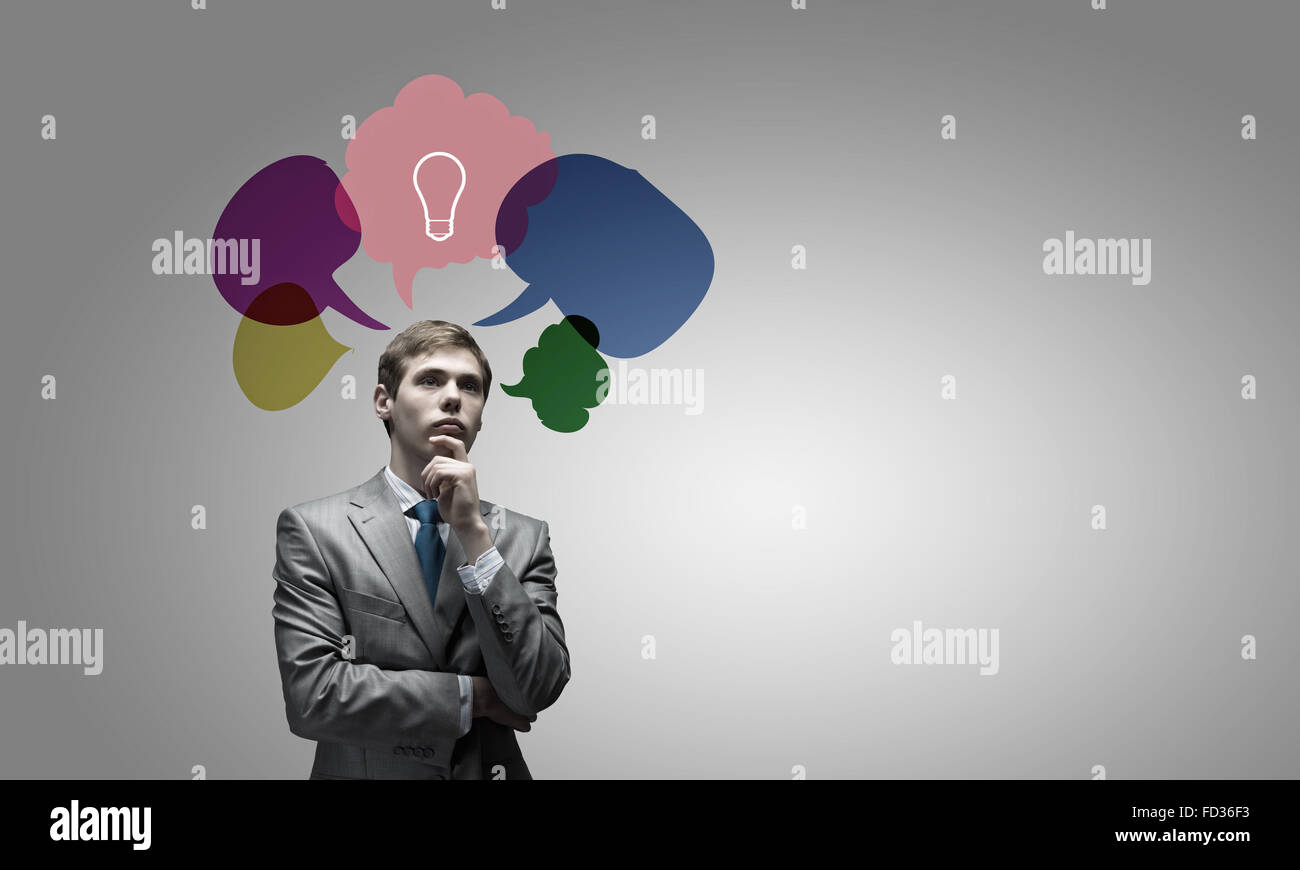 Young businessman and colorful thoughts above her head Stock Photo - Alamy
