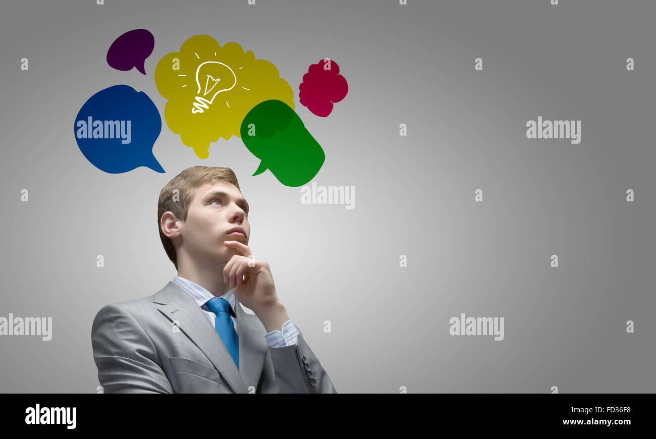 Young businessman and colorful thoughts above her head Stock Photo - Alamy