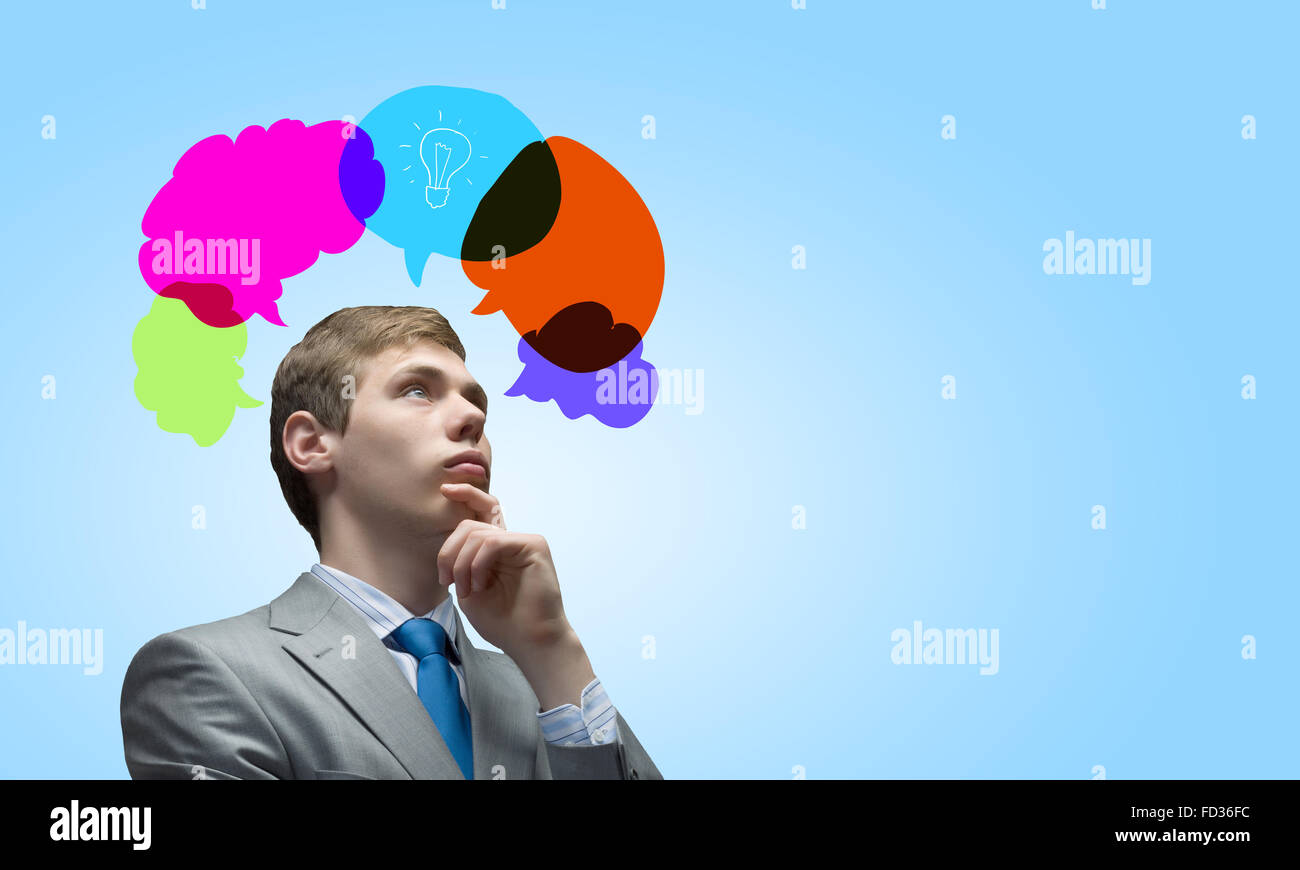 Young businessman and colorful thoughts above her head Stock Photo - Alamy