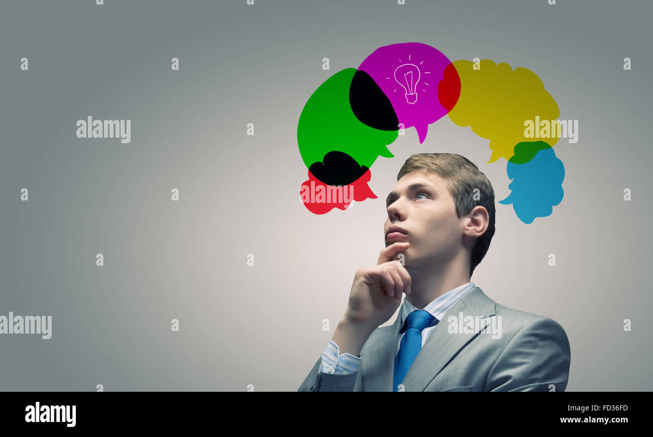 Young businessman and colorful thoughts above her head Stock Photo - Alamy