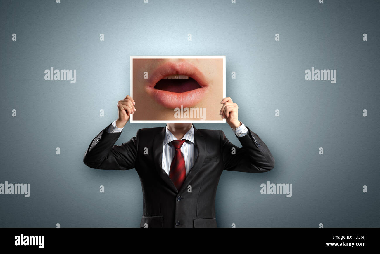 Unrecognizable businessman hiding face behind photo of mouth Stock ...
