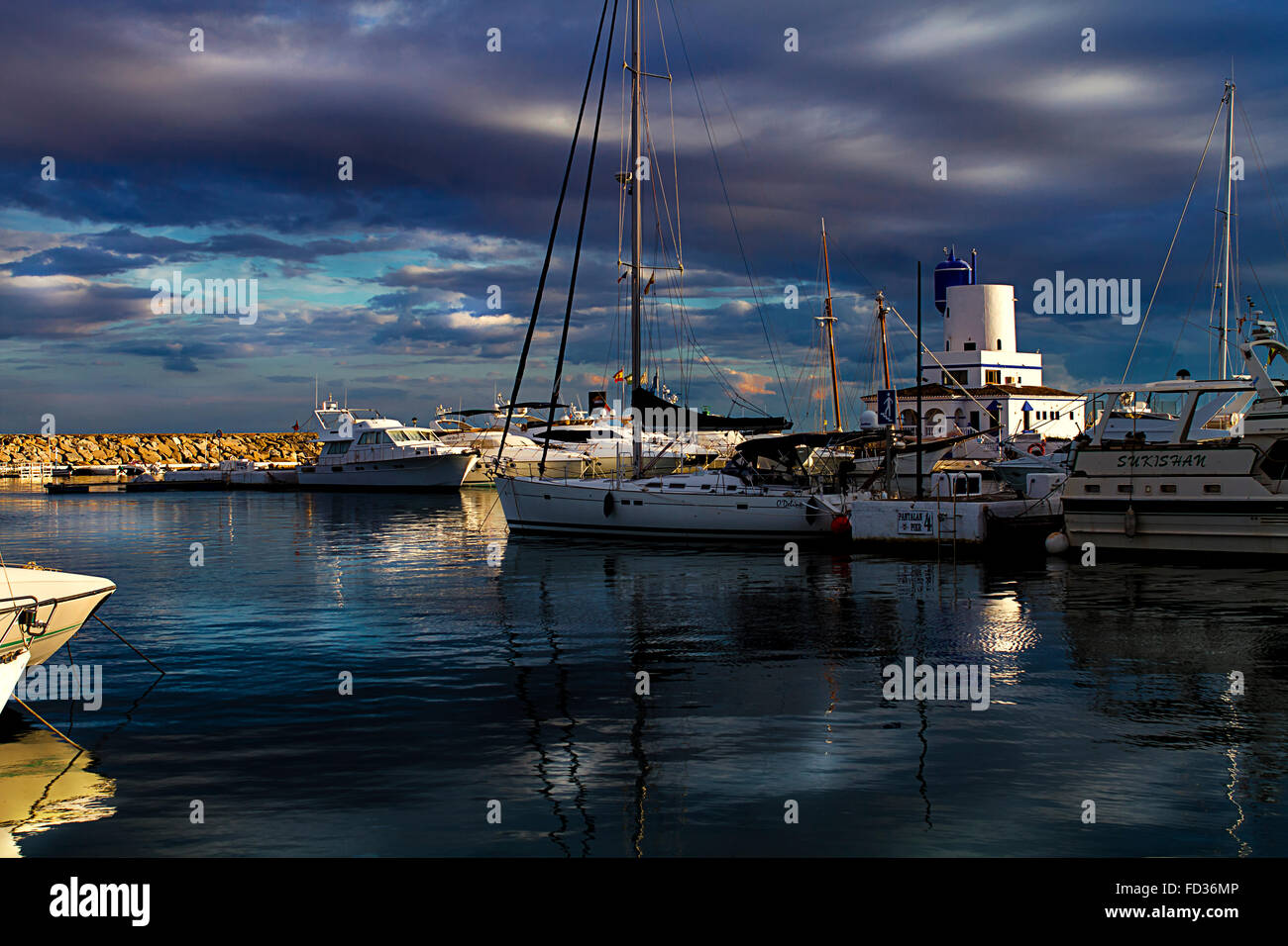 Jetty port at sunset Stock Photo - Alamy