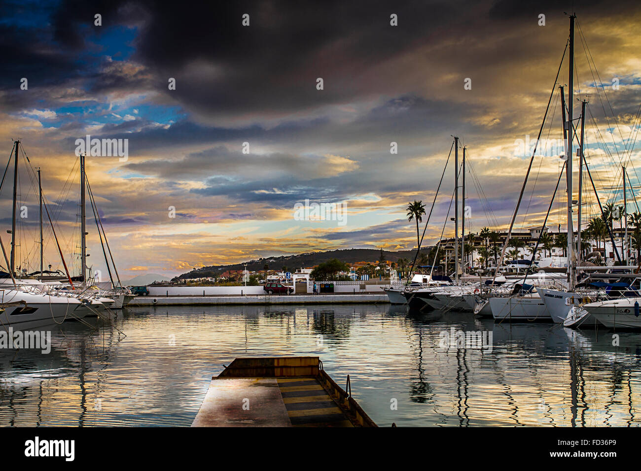 Jetty port at sunset Stock Photo - Alamy