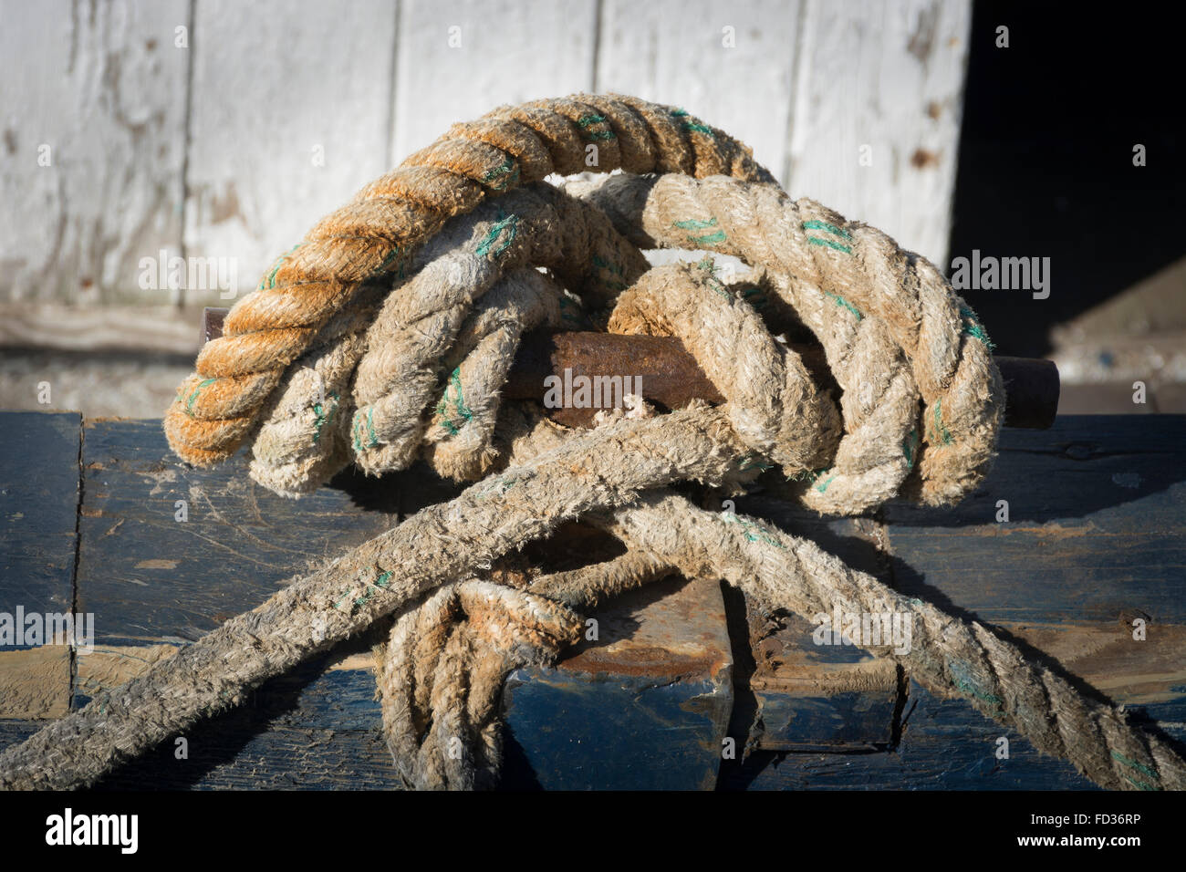 Fishing boat mooring line on a pier cleat, Gloucester, MA Stock Photo ...