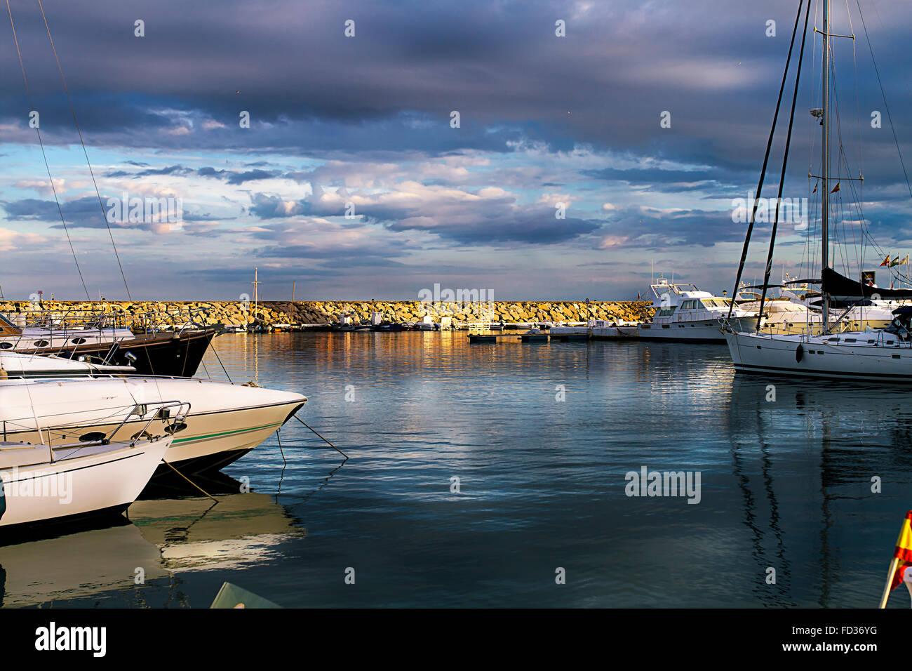 Jetty port at sunset Stock Photo - Alamy