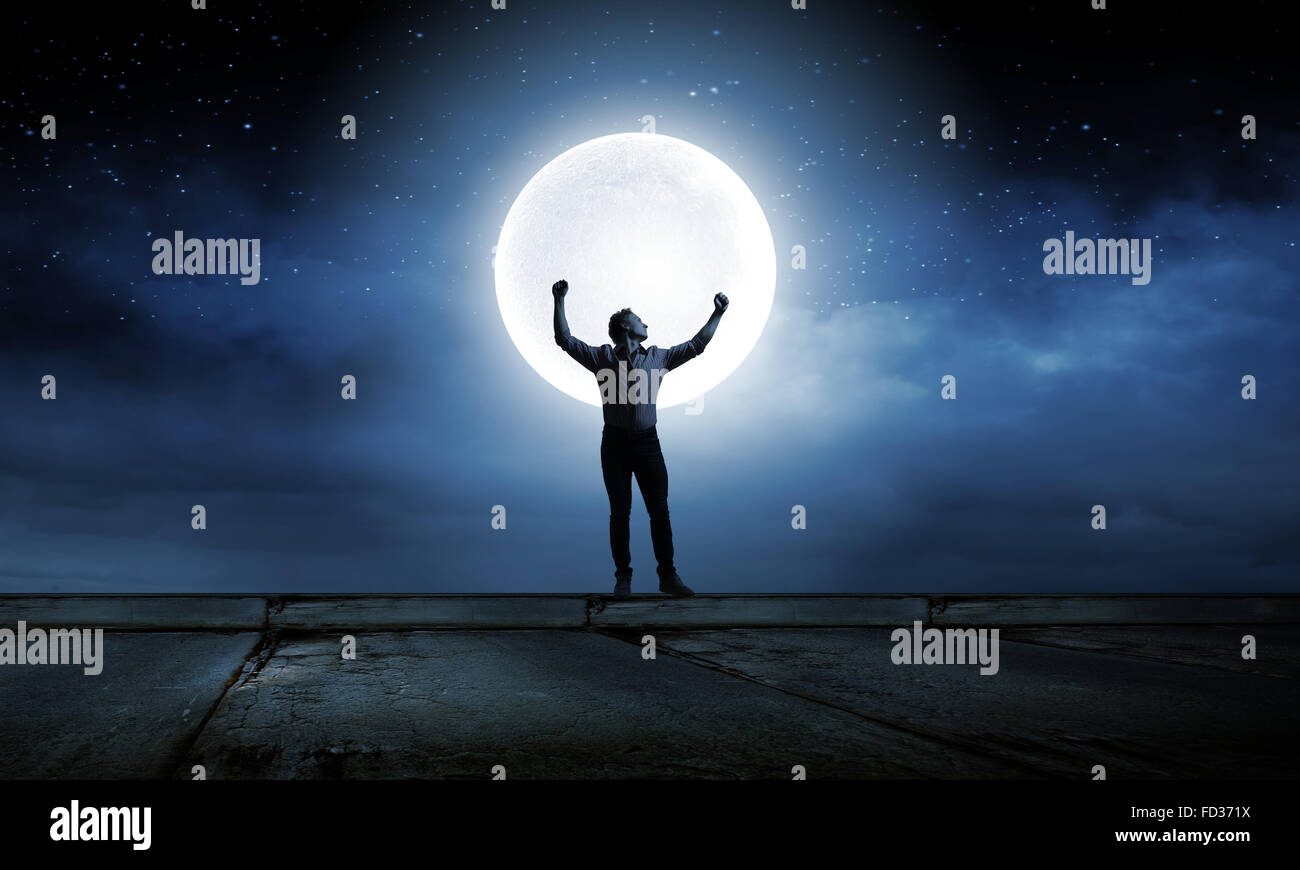 Silhouette of screaming man celebrating success Stock Photo - Alamy