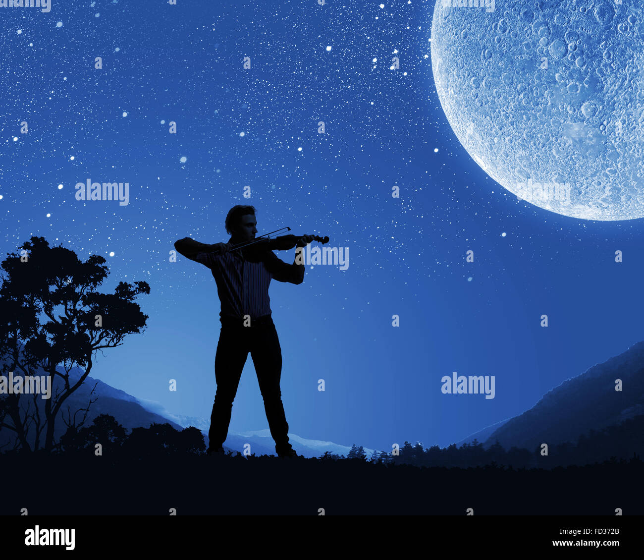 Young man playing violin at night under moon light Stock Photo - Alamy