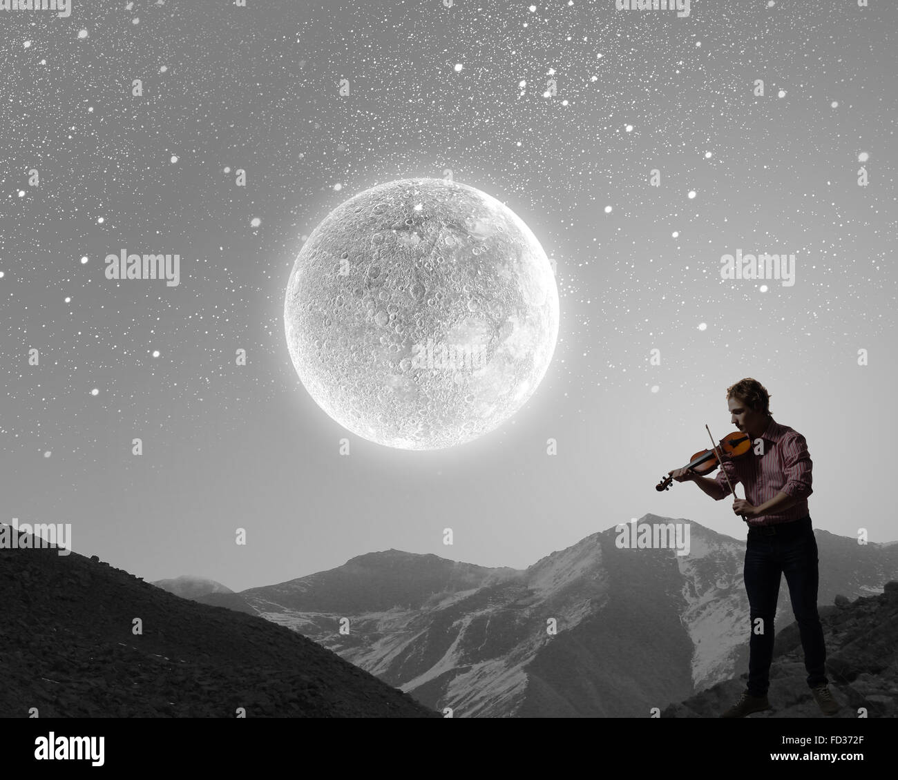Young man playing violin at night under moon light Stock Photo - Alamy