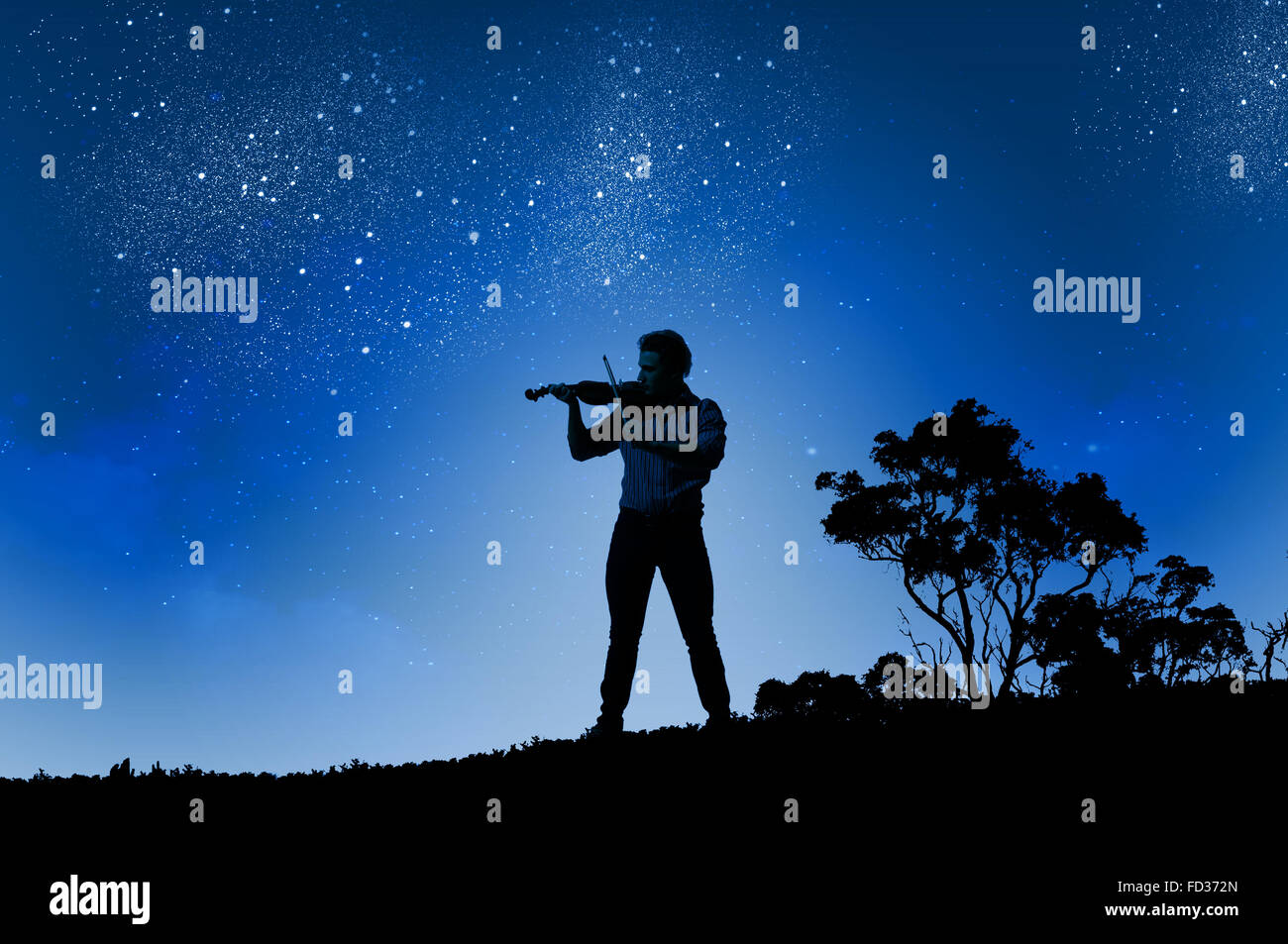 Young man playing violin at night under moon light Stock Photo - Alamy