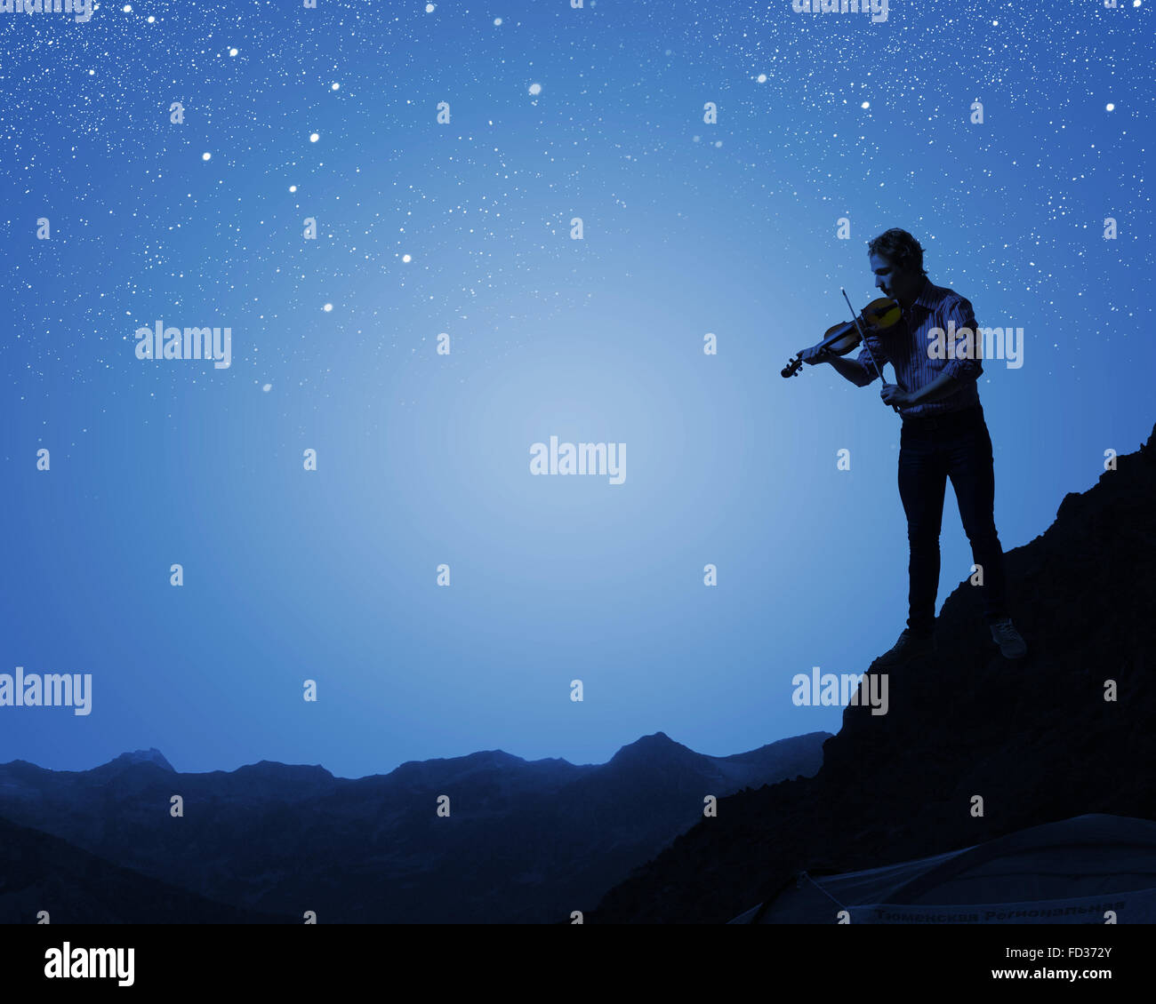Young man playing violin at night under moon light Stock Photo - Alamy
