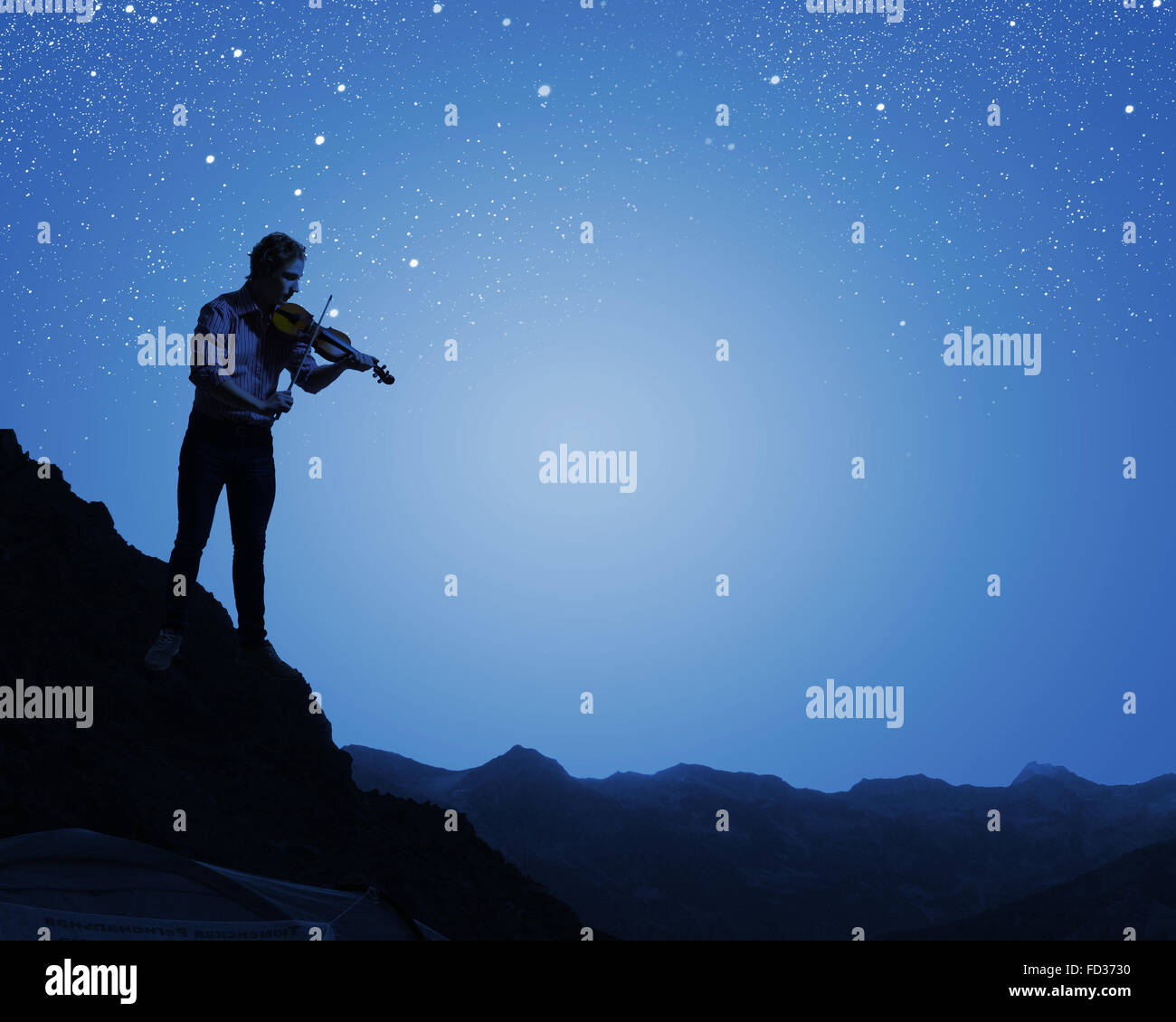 Young man playing violin at night under moon light Stock Photo - Alamy