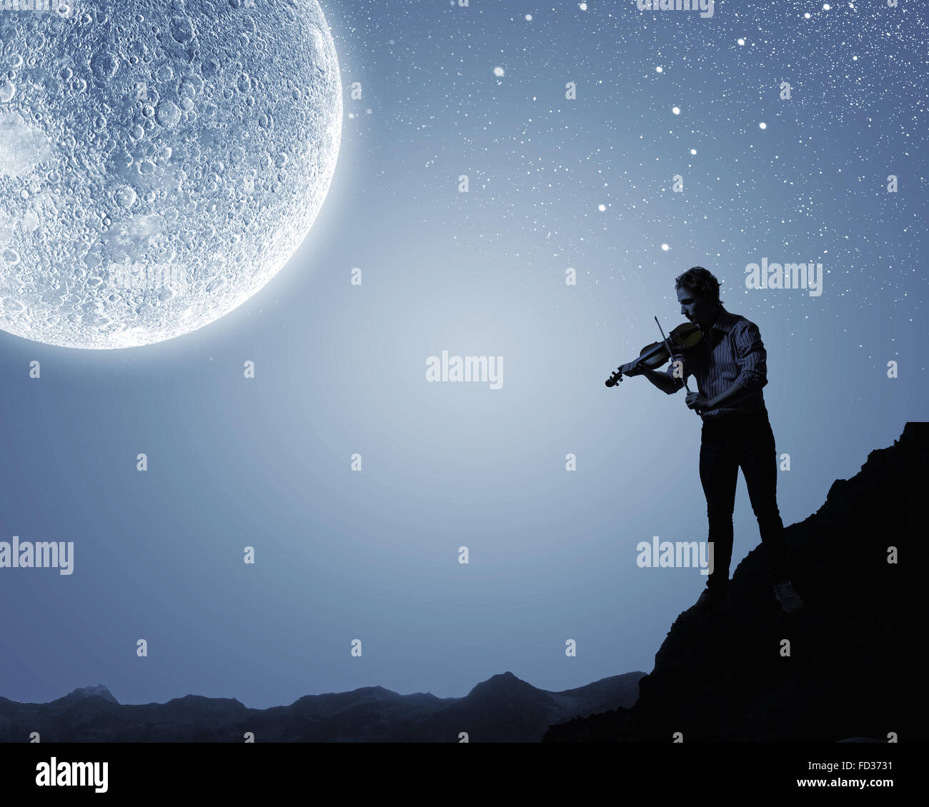 Young man playing violin at night under moon light Stock Photo - Alamy