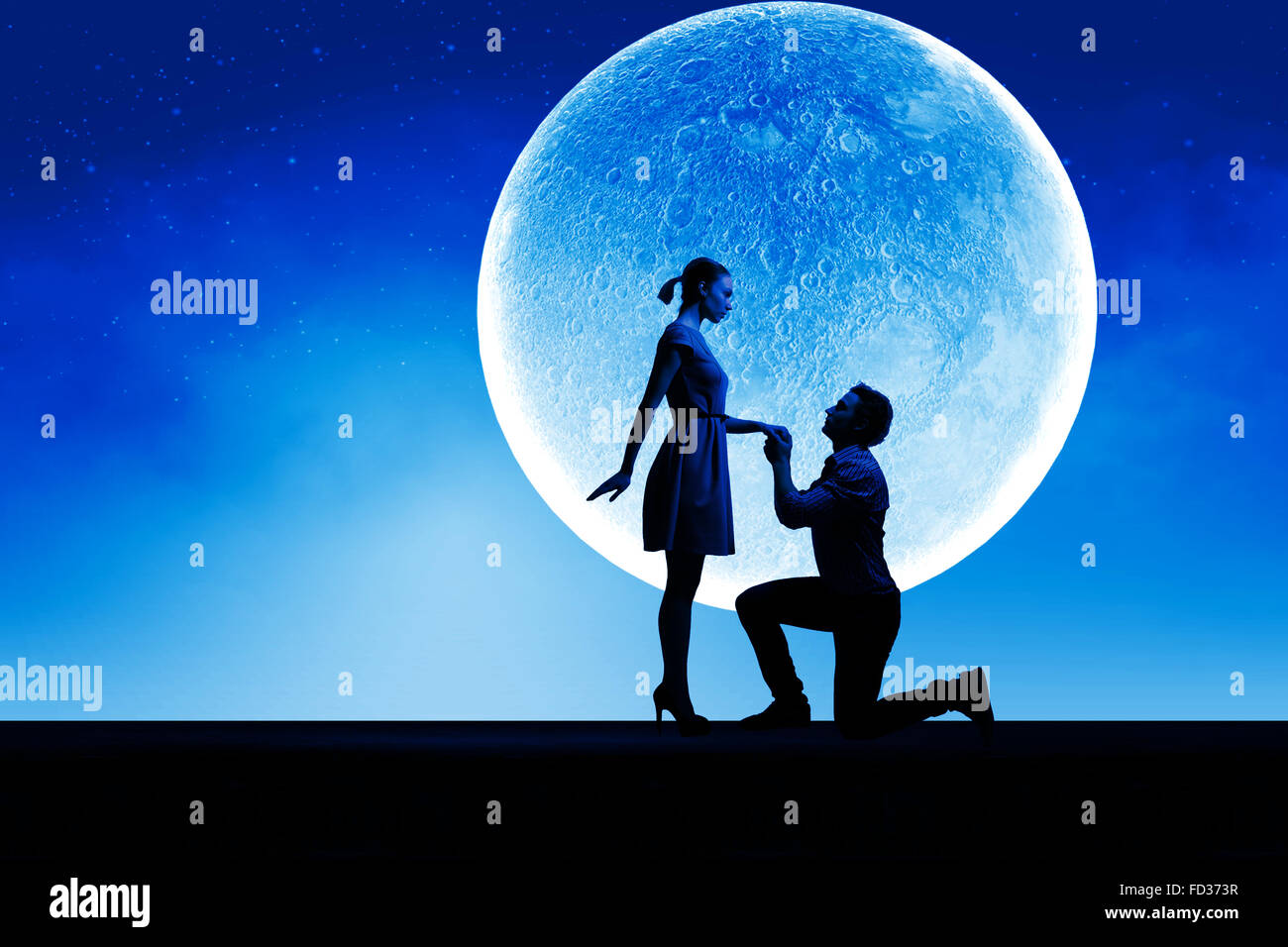 Silhouettes of romantic couple under the moon light Stock Photo - Alamy