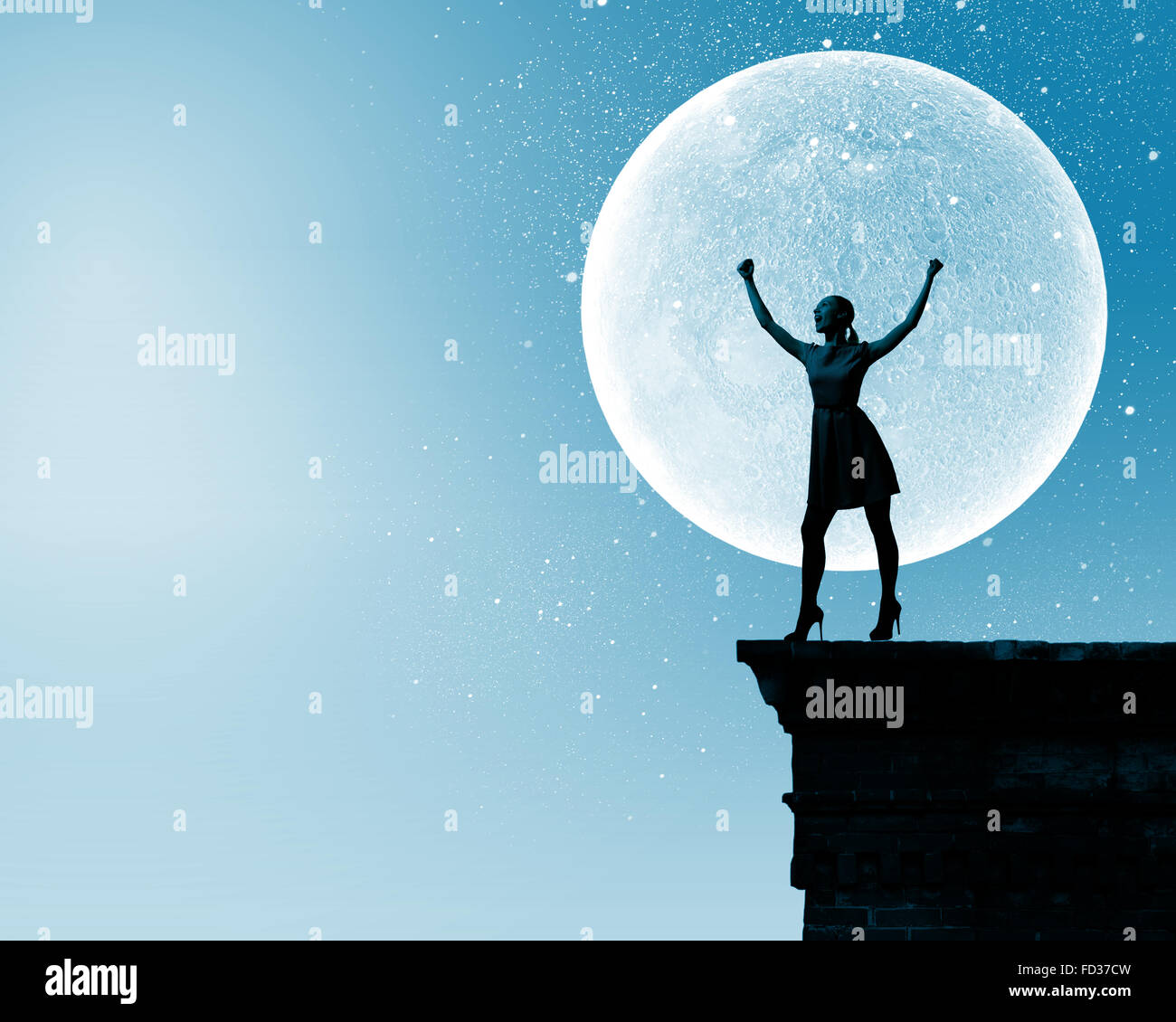 Silhouette of woman against full moon with hands up Stock Photo - Alamy