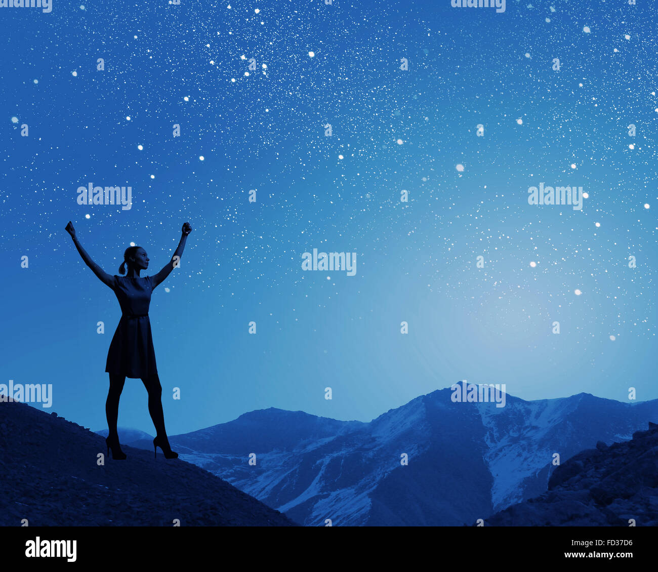 Silhouette of woman in dress at night with hands up Stock Photo - Alamy