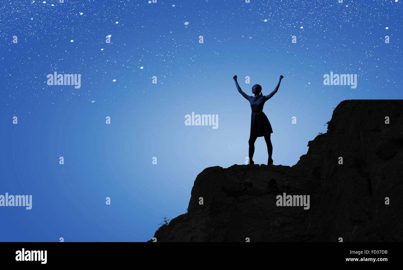 Silhouette of woman in dress at night with hands up Stock Photo - Alamy