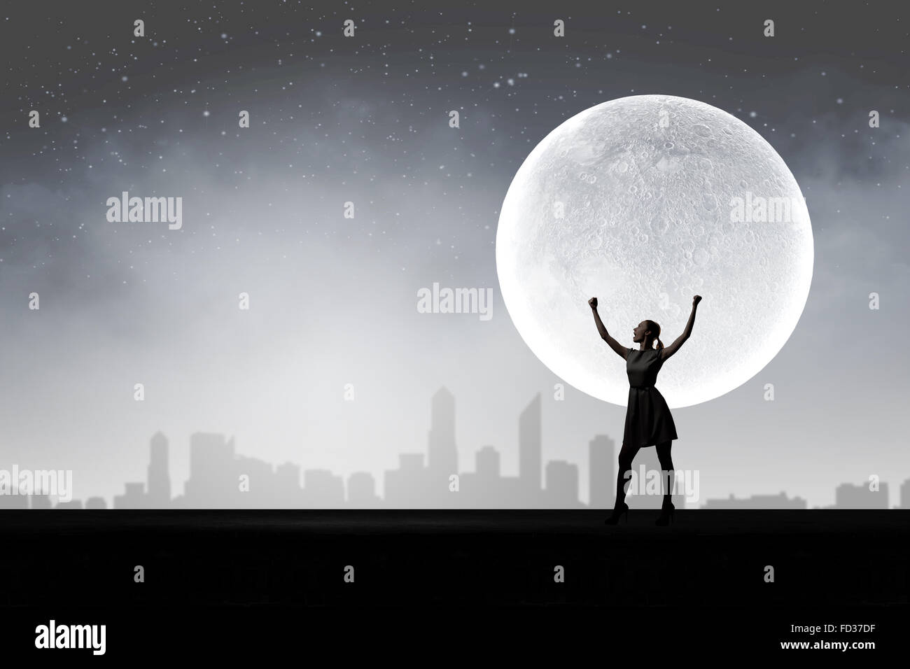 Silhouette of woman against full moon with hands up Stock Photo - Alamy