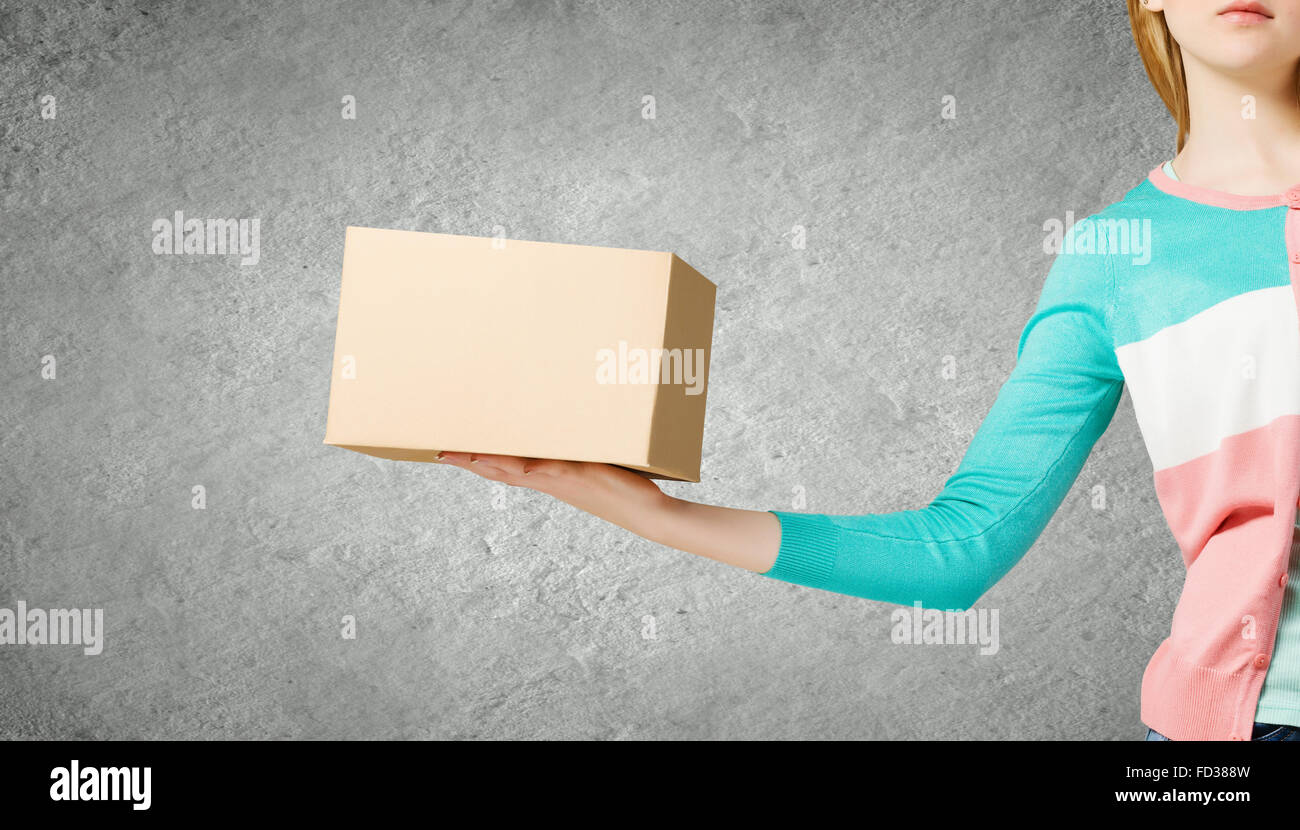 Close up of woman hand holding carton box Stock Photo - Alamy
