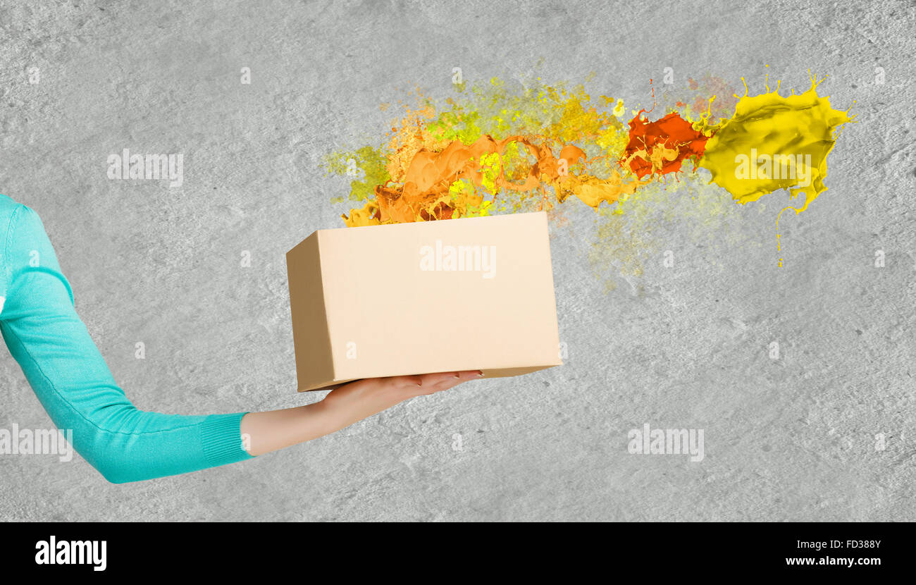 Close up of woman hand holding carton box Stock Photo - Alamy