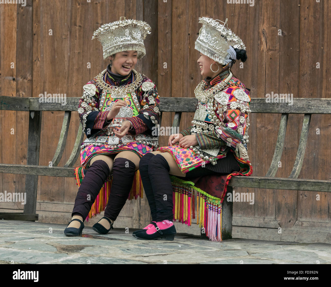 A Happy Momemnt Short Skirt Miao Girls On A Bench Datang Village Guizhou Province China