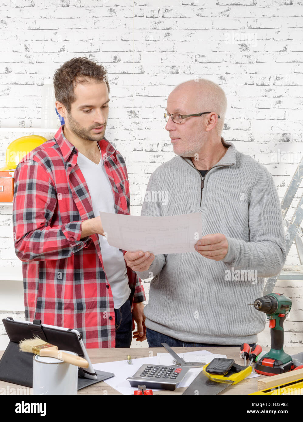 Two engineers reading plan hi-res stock photography and images - Alamy