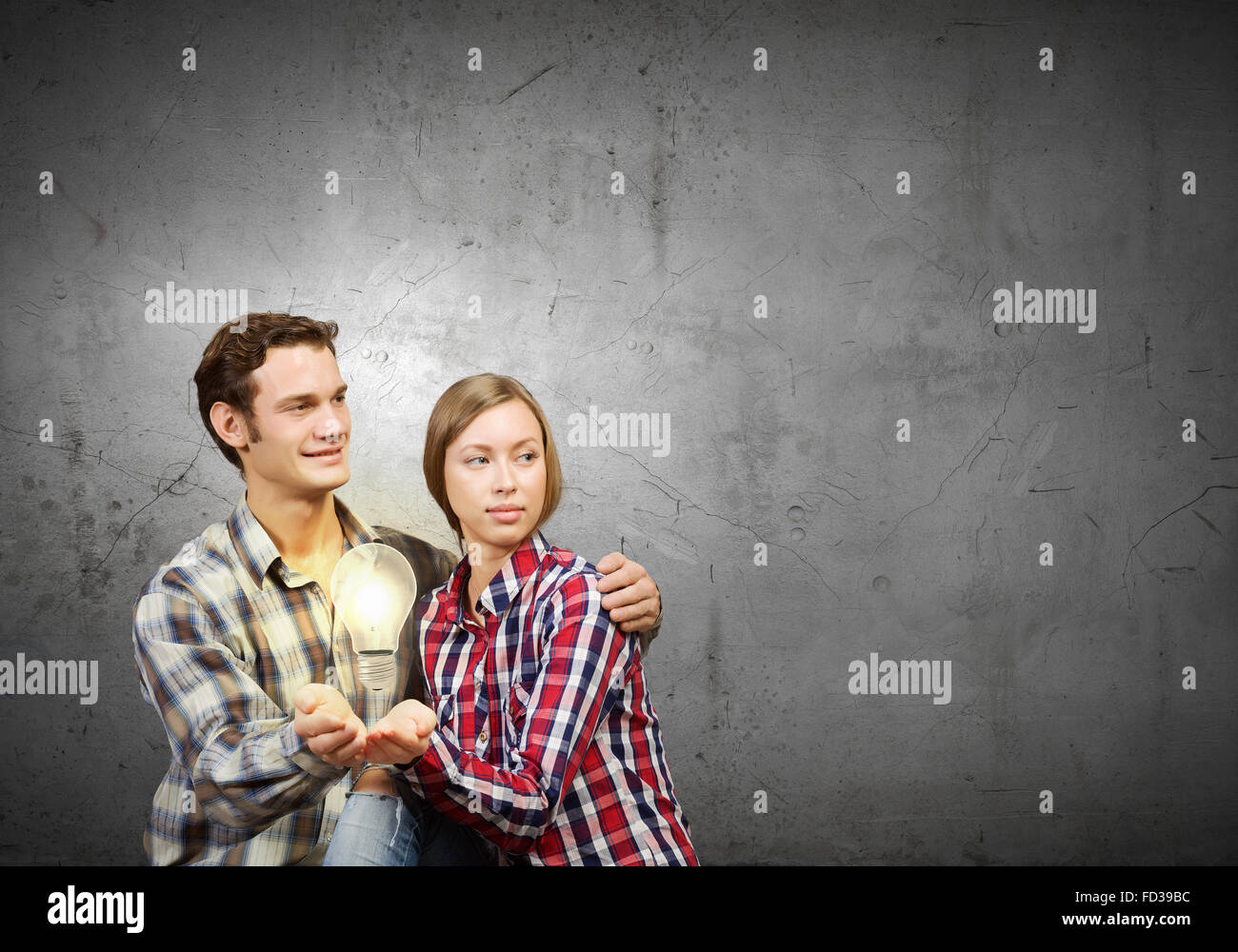 Young happy couple hugging each other Stock Photo - Alamy