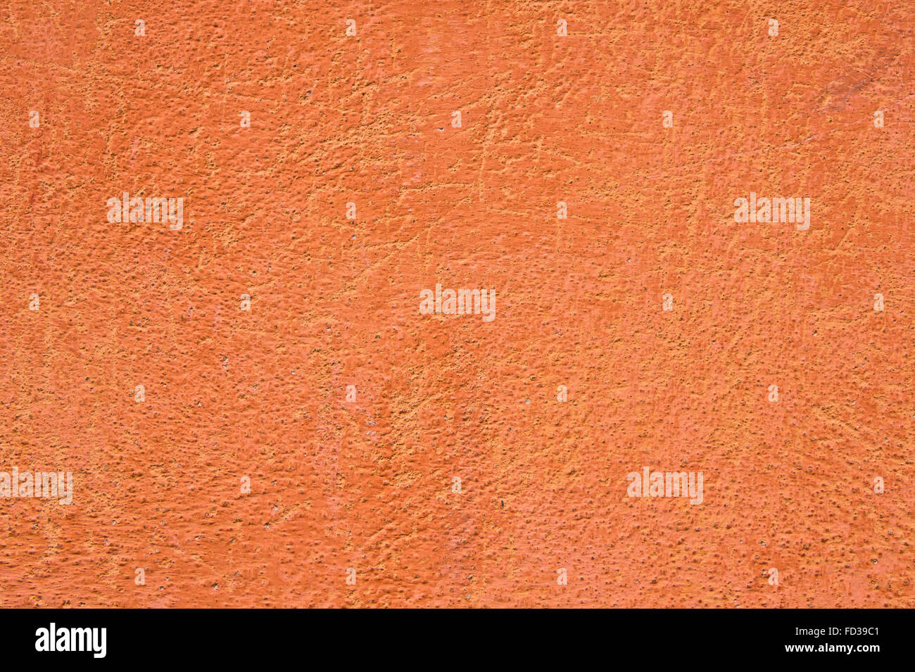 Part of an orange painted stone wall as a textured background Stock ...