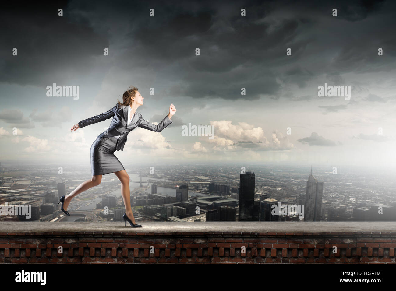 Young pretty businesswoman in suit running away Stock Photo - Alamy