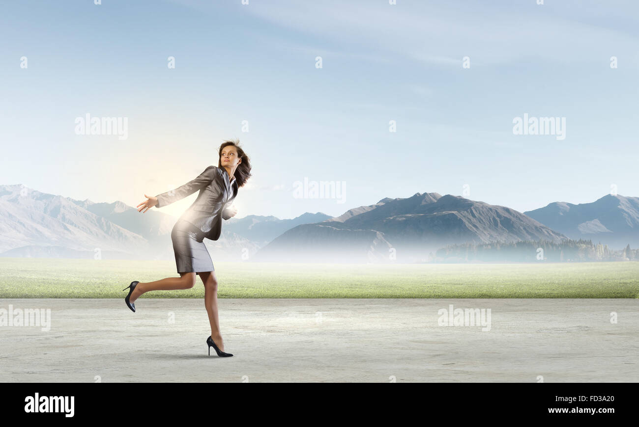 Girl in suit running hi-res stock photography and images - Alamy