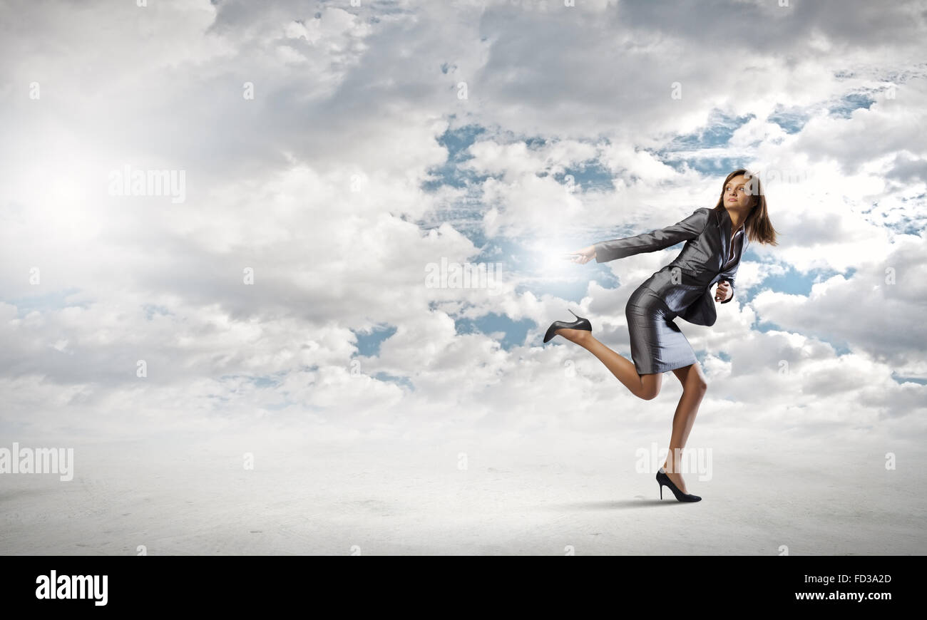 Girl in suit running hi-res stock photography and images - Alamy