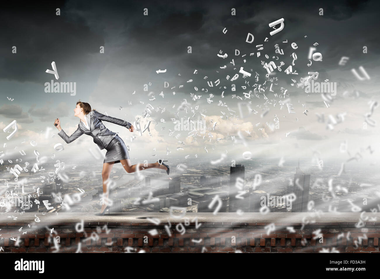 Young pretty businesswoman in suit running away Stock Photo - Alamy