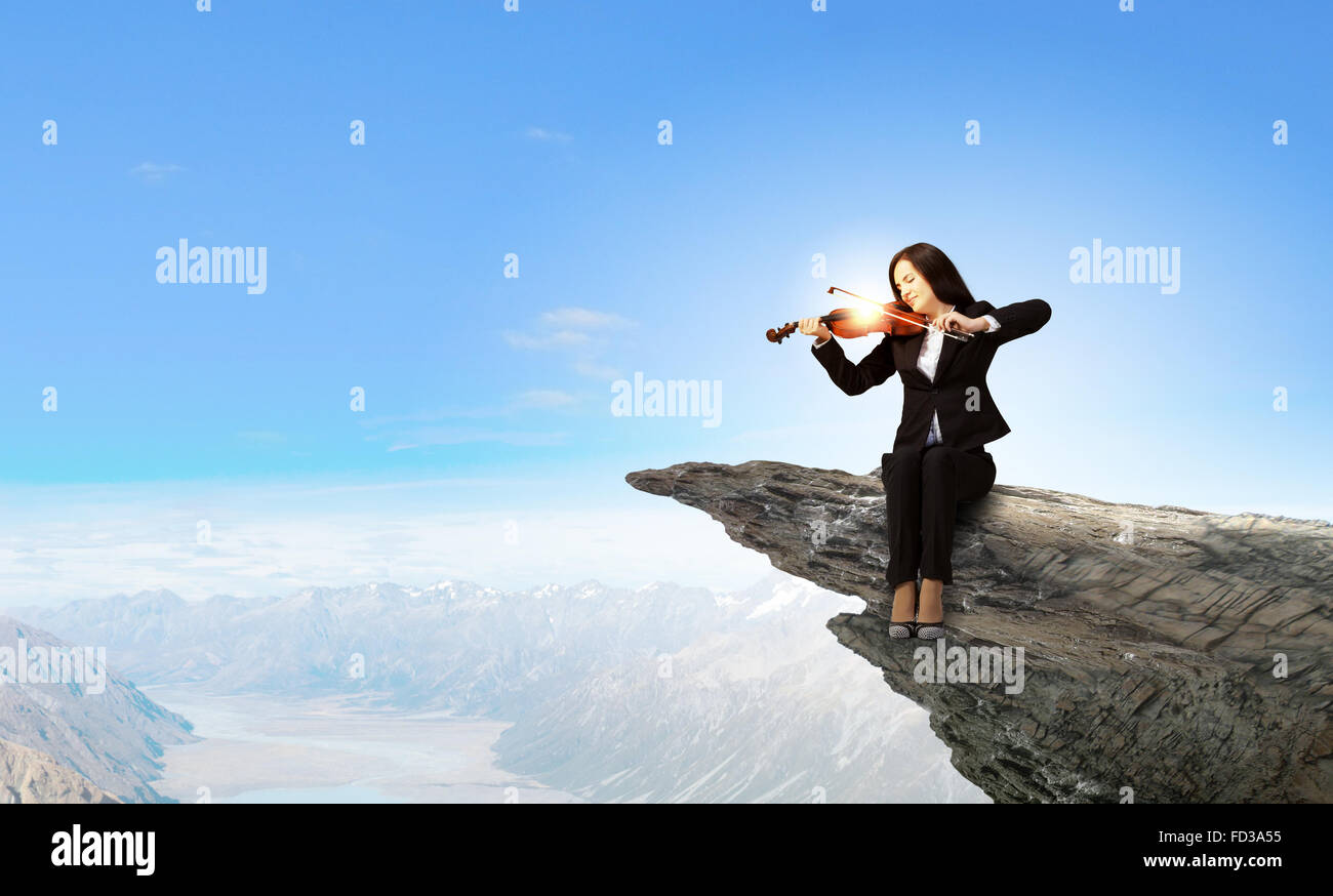 Beautiful young woman sitting violin hi-res stock photography and ...