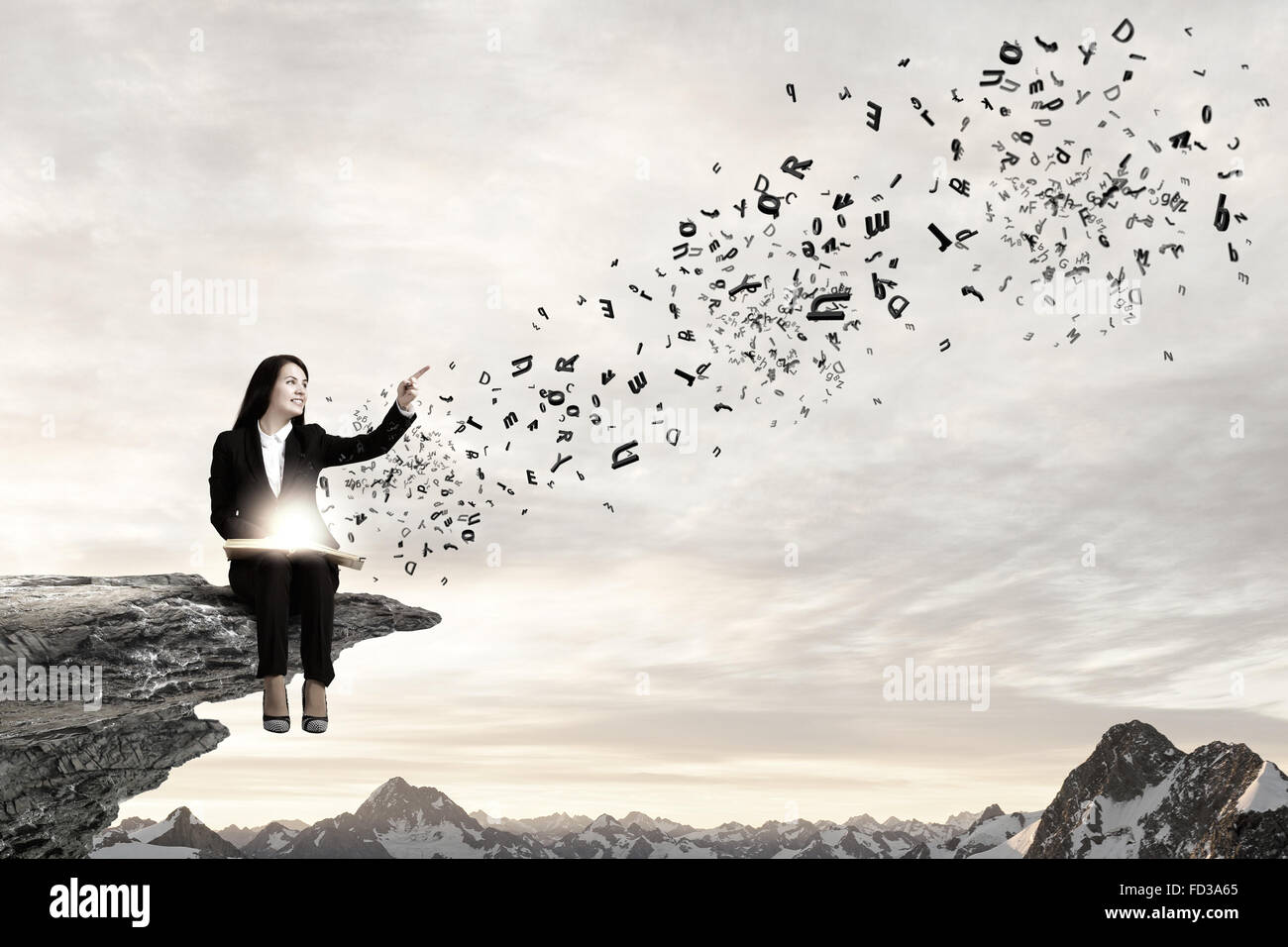 Young pretty lady with book in hands Stock Photo - Alamy
