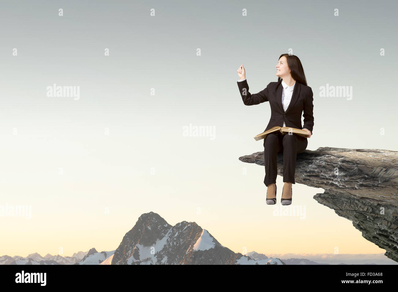 Young pretty lady with book in hands Stock Photo - Alamy