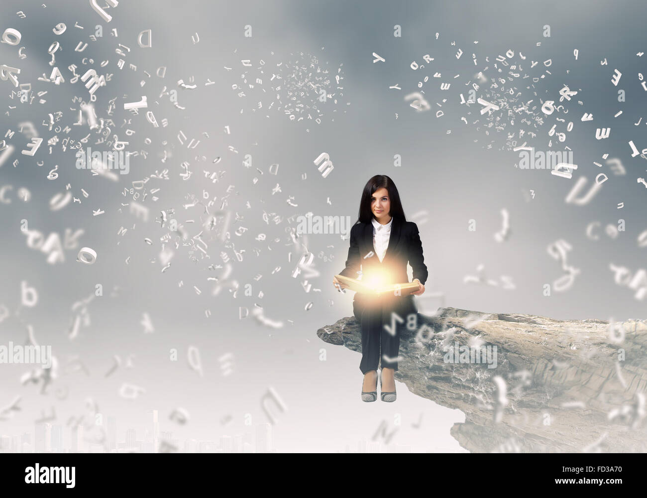 Young pretty lady with book in hands Stock Photo - Alamy