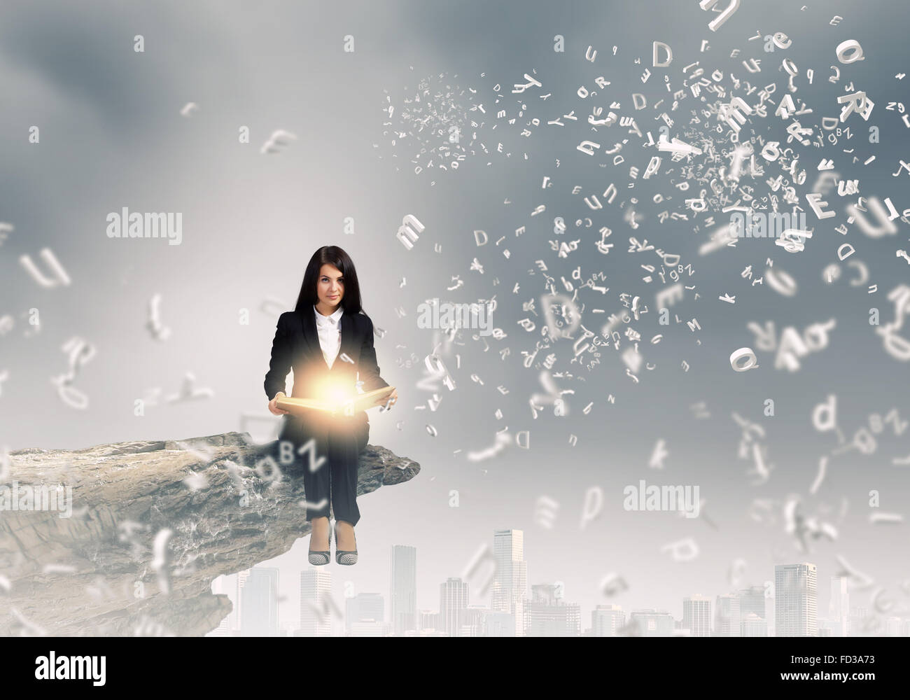 Young pretty lady with book in hands Stock Photo - Alamy