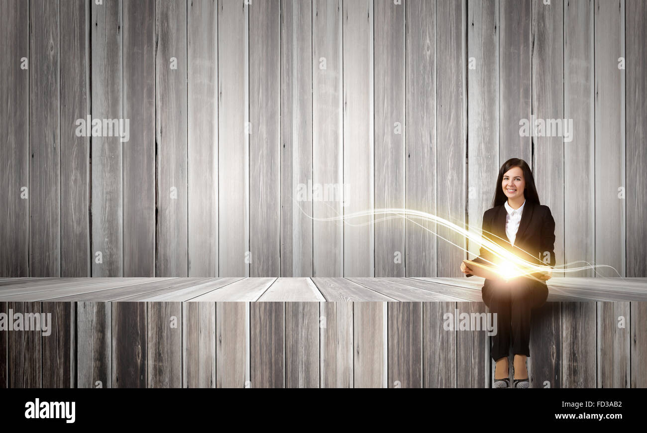 Young pretty lady with book in hands Stock Photo - Alamy