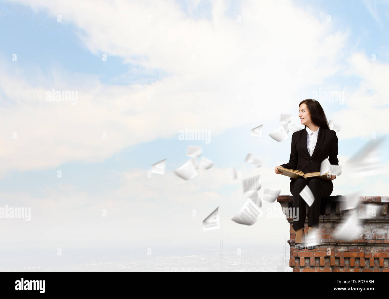 Young pretty lady with book in hands Stock Photo - Alamy