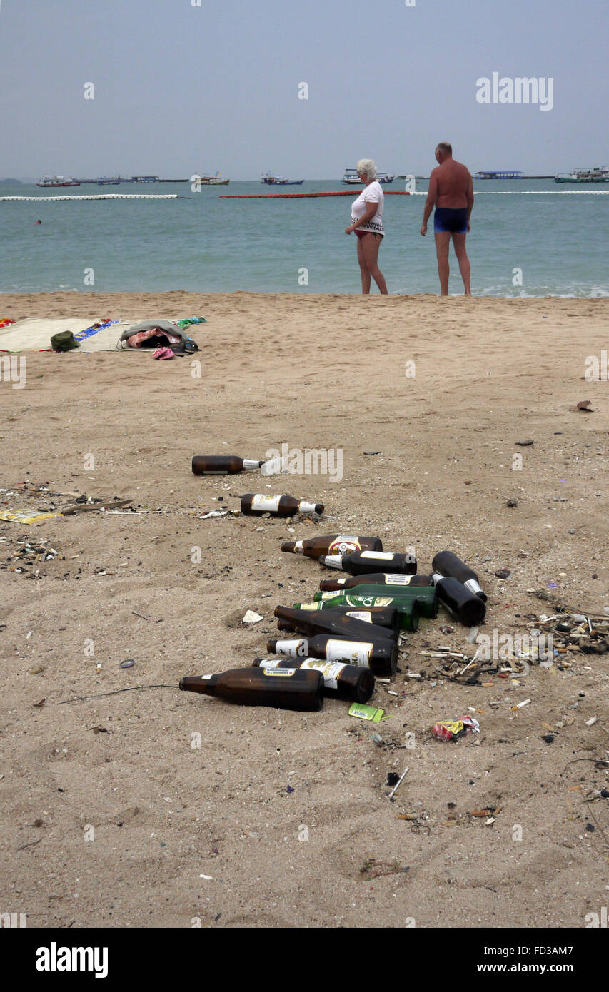 Empty beer bottles left abandoned littering the beach in Pattaya ...
